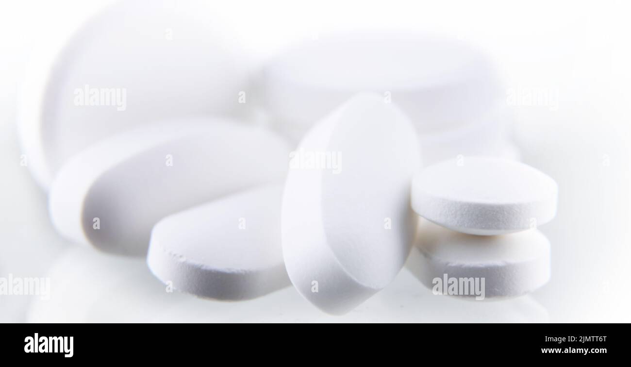 Composition with pharmaceutical drug pills over white background Stock ...