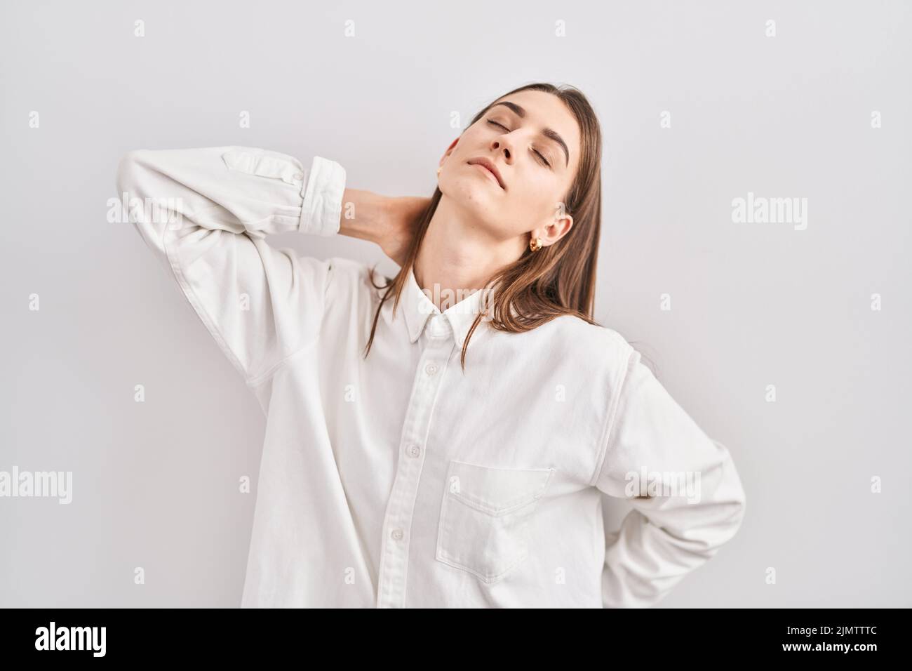 Young caucasian woman standing over isolated background suffering of ...