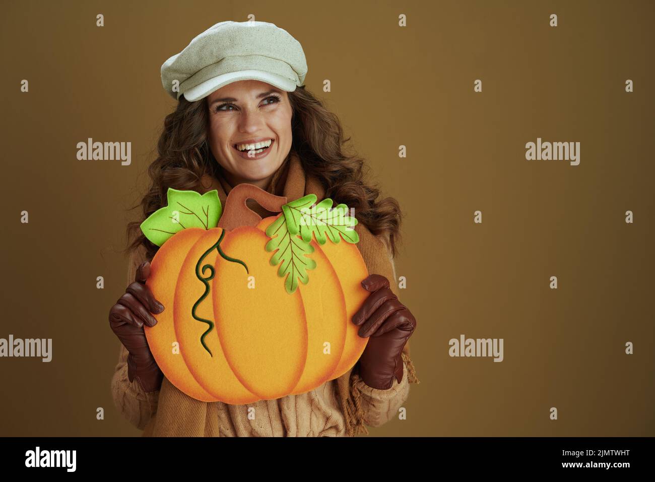Hello november. happy young woman in scarf with decorative pumpkin and ...