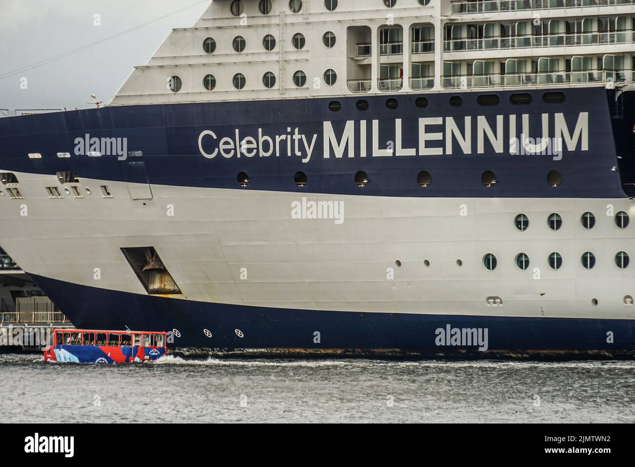 Luxury liner and (Celebrity Millennium) Water bus Stock Photo - Alamy