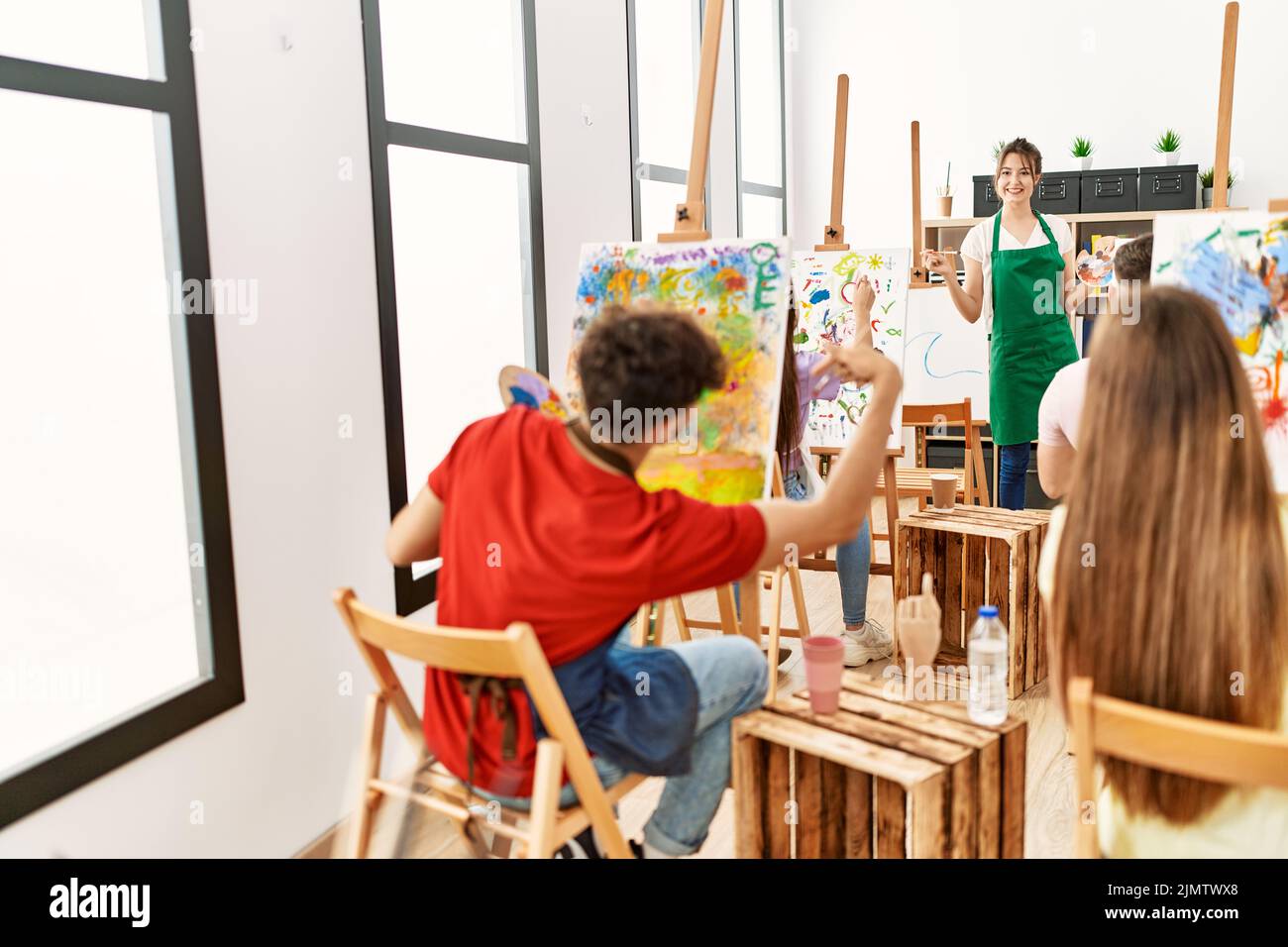 Group of people smiling happy having paint class at art studio Stock ...