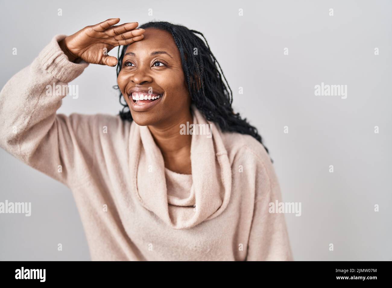 African woman standing over white background very happy and smiling ...