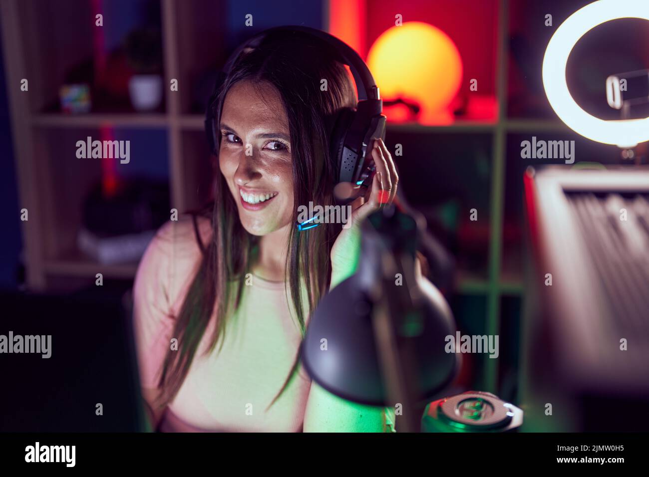 Young beautiful hispanic woman streamer smiling confident sitting on ...