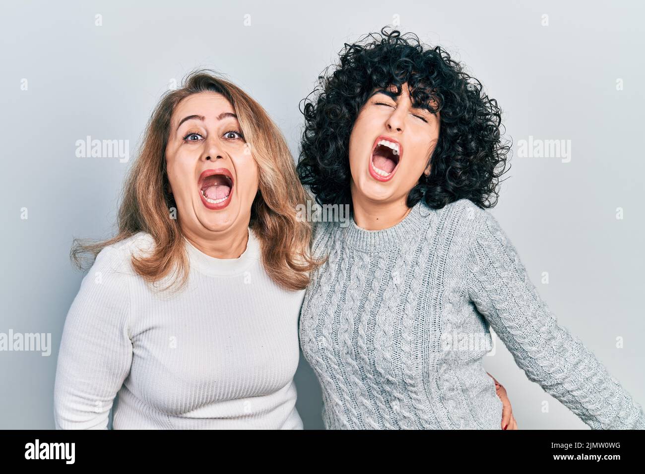 Middle east mother and daughter wearing casual clothes angry and mad ...