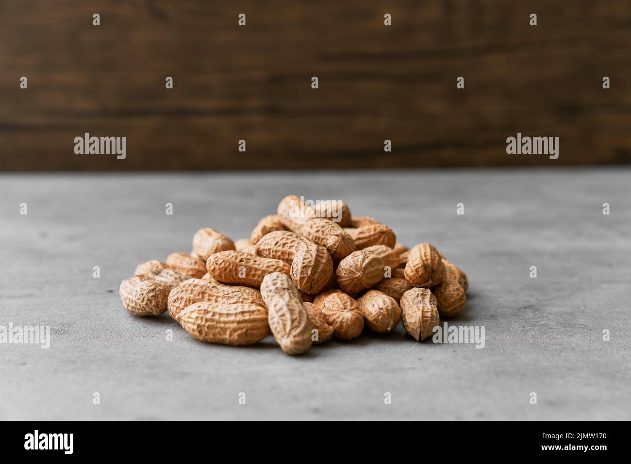 Image of bunch of peanuts on a concrete surface Stock Photo - Alamy