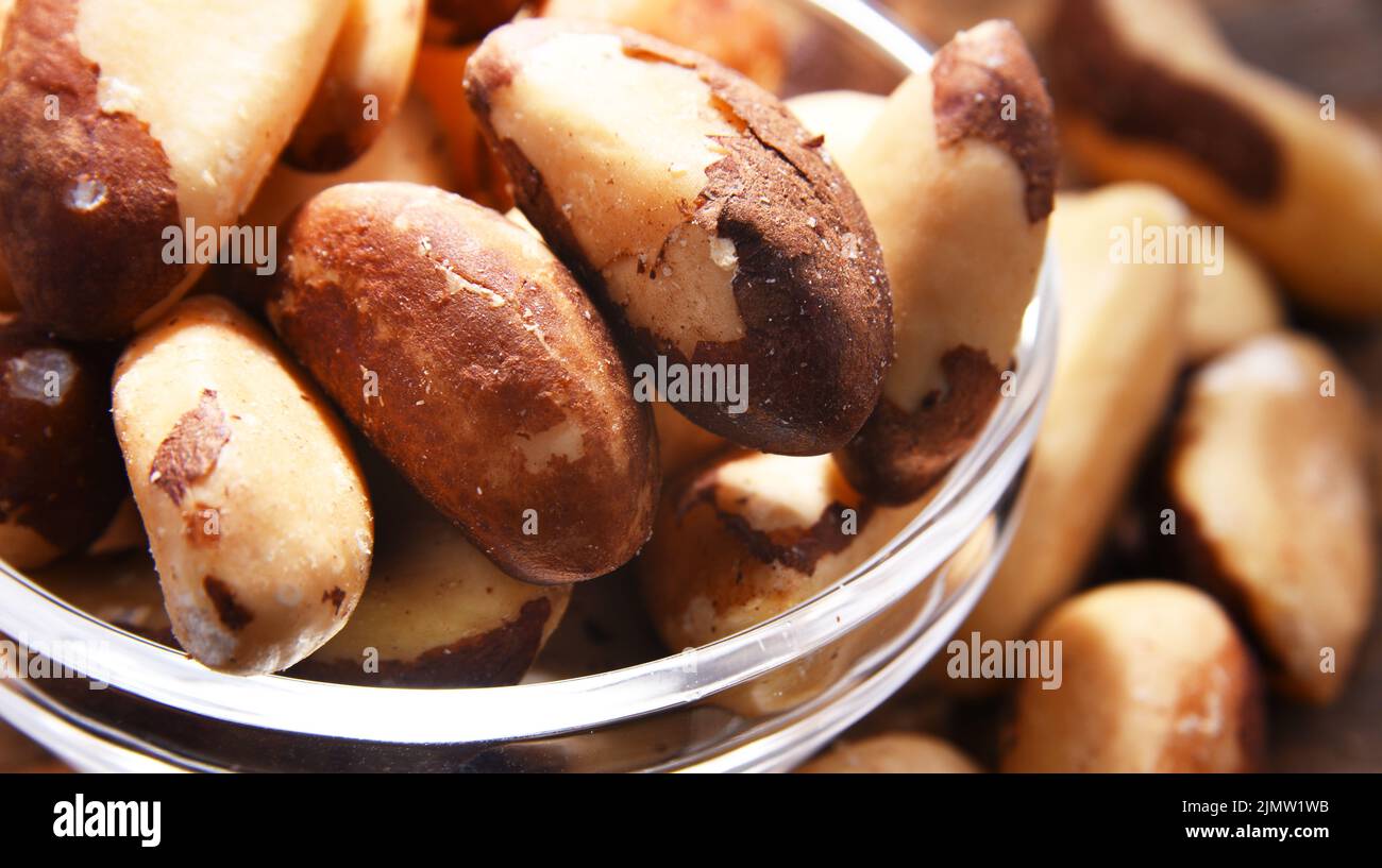 Composition with a bowl of shelled brazil nuts. Delicacies Stock Photo ...