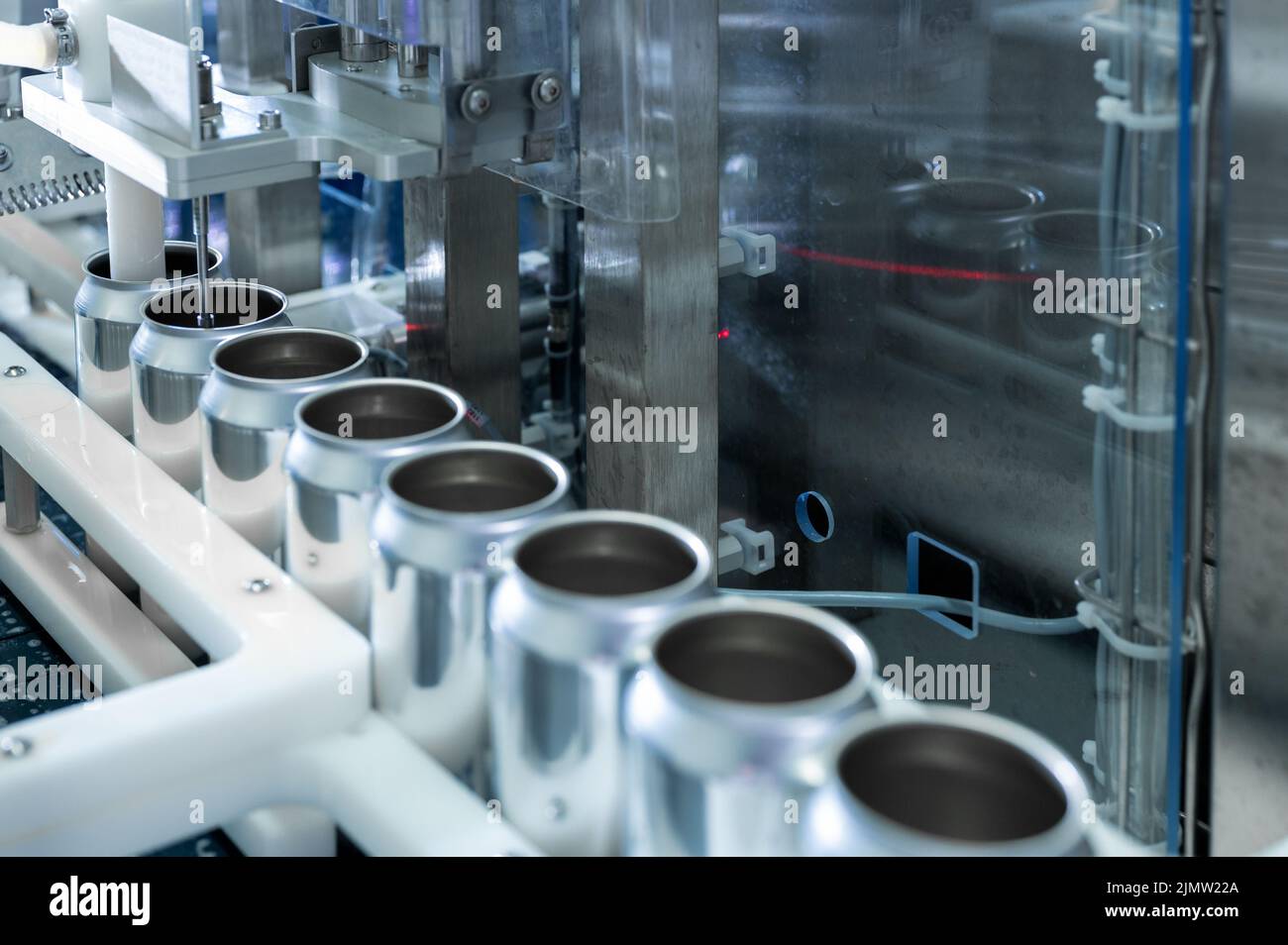 Empty new aluminum cans for drink process in factory line on conveyor ...