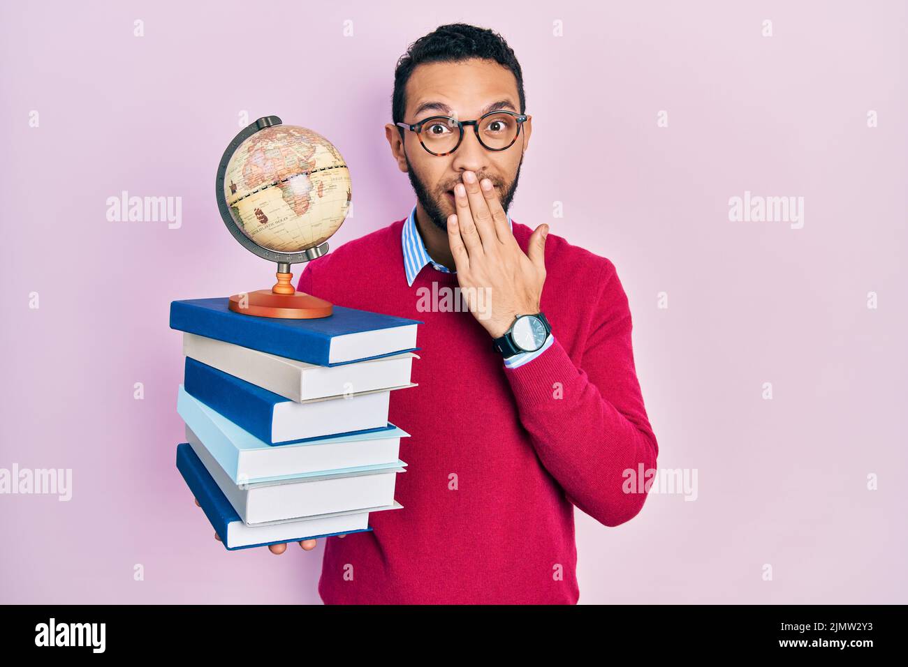Hispanic man with beard geography teacher covering mouth with hand ...