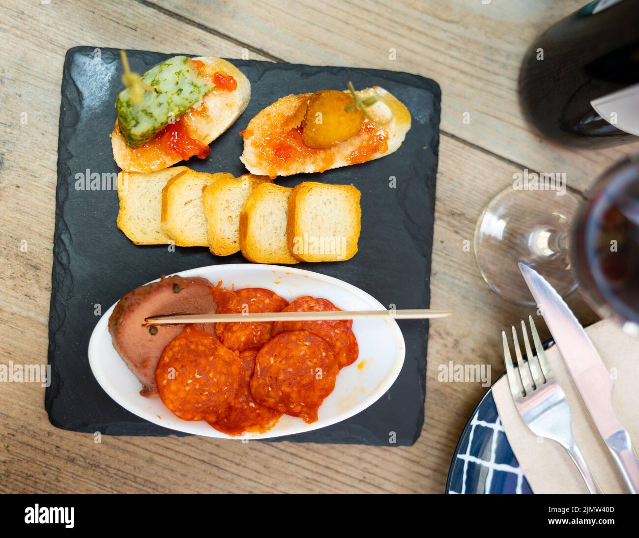 Assorted Spanish tapas with cheese and sausage Stock Photo - Alamy