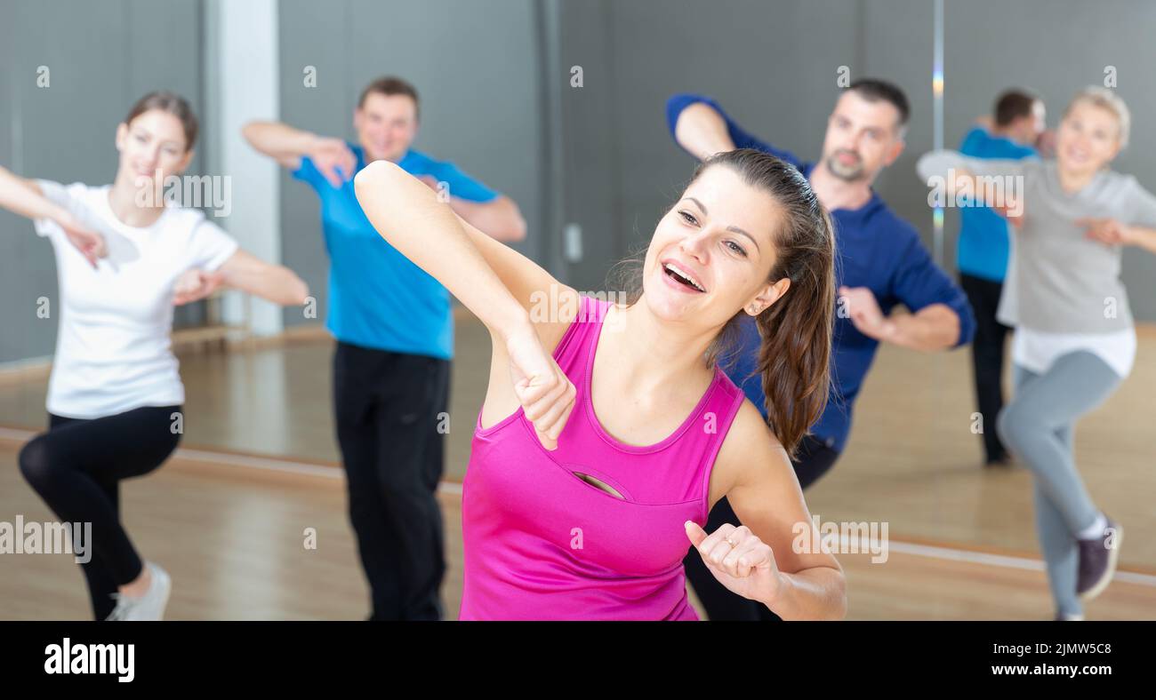 Woman training at group dance class Stock Photo - Alamy