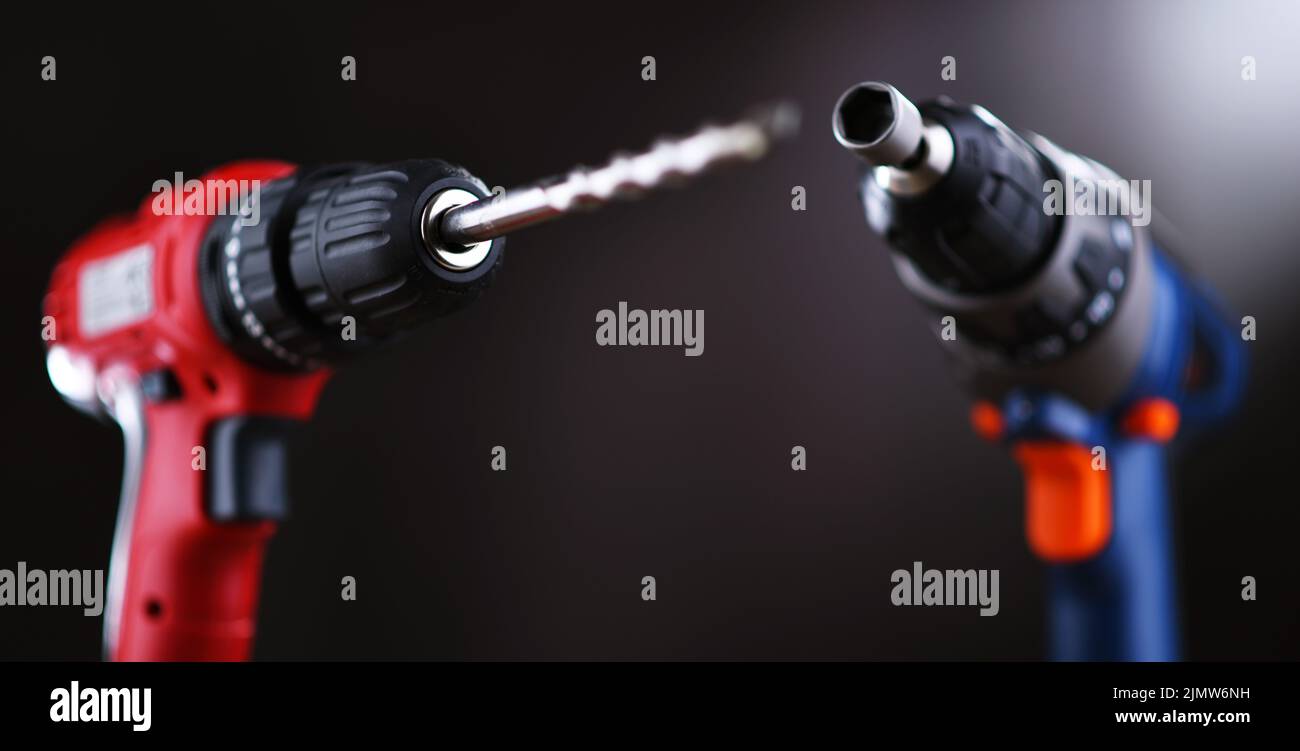 A pistol-grip cordless drill and a screw gun Stock Photo - Alamy