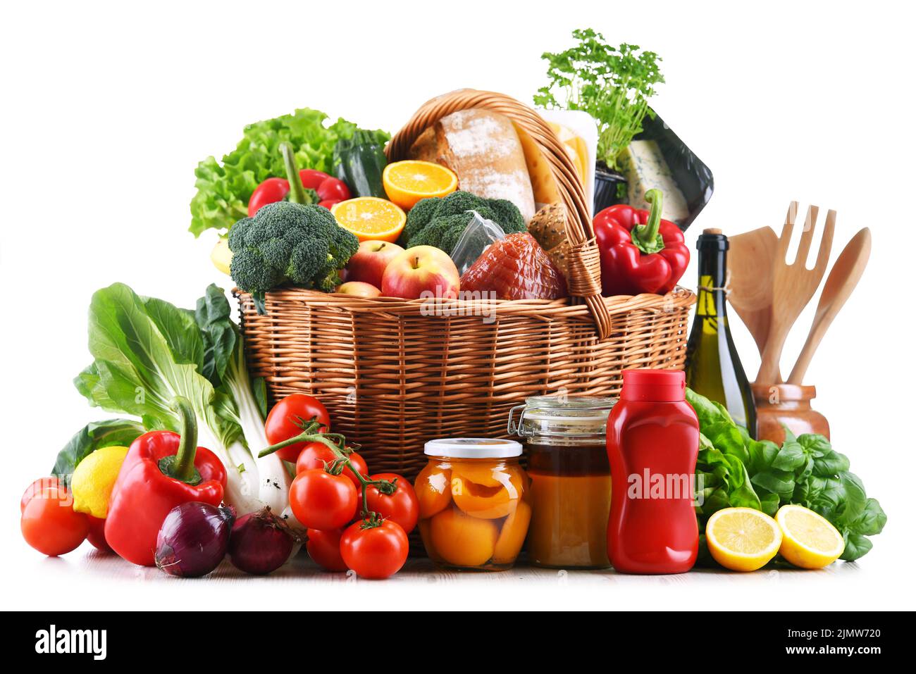 Wicker basket with assorted grocery products Stock Photo - Alamy