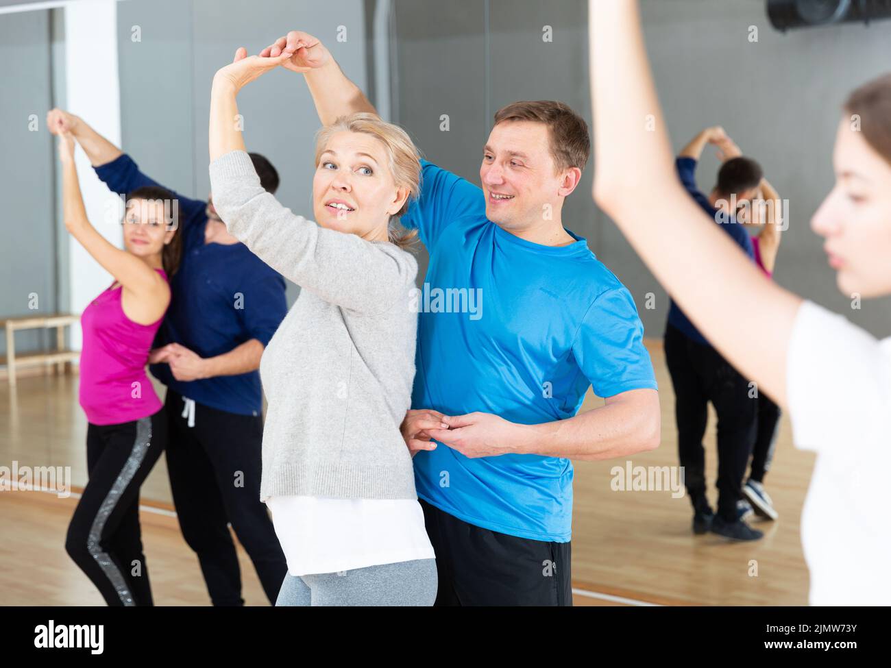 Mature dancing couple during group class Stock Photo - Alamy
