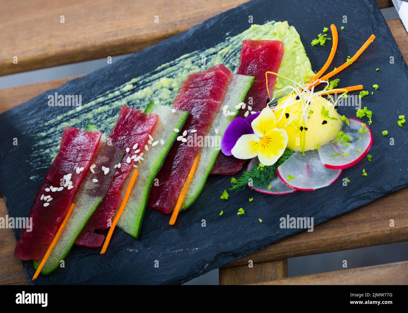 Tuna sashimi with cucumber and avocado sauce Stock Photo - Alamy