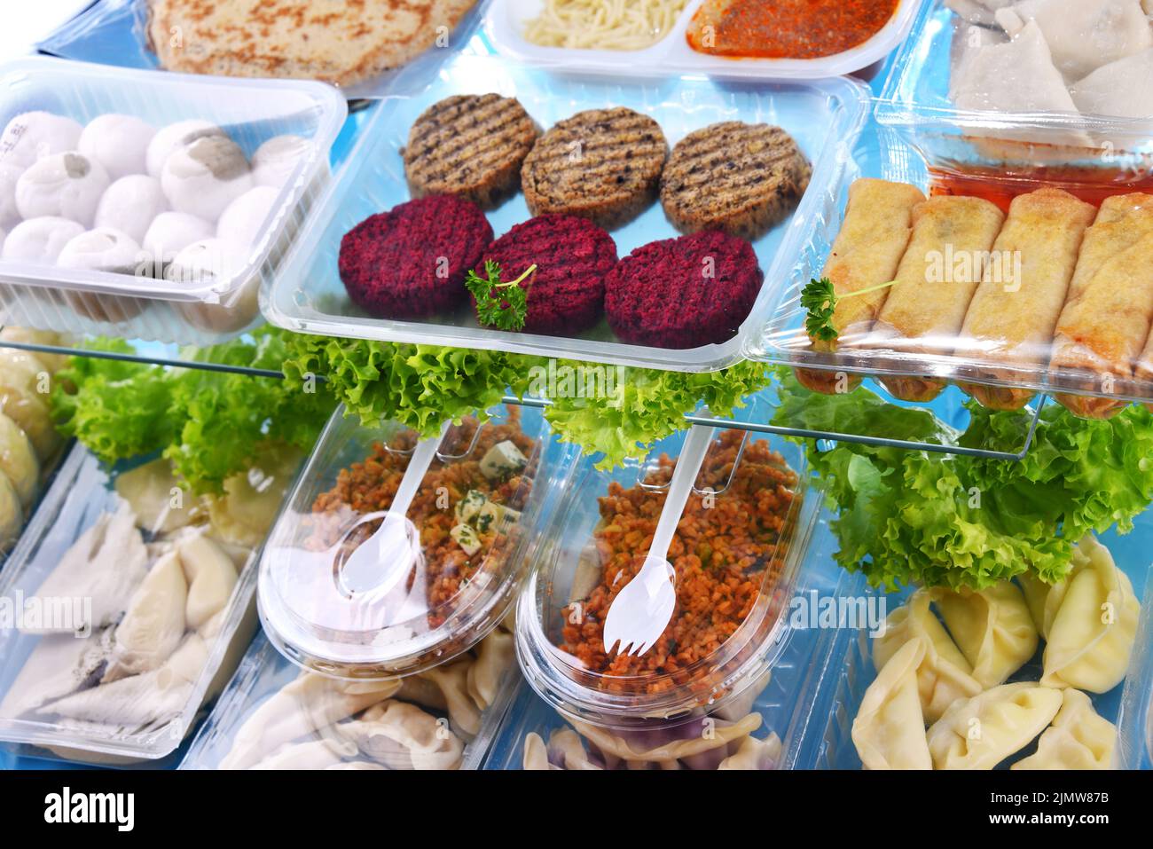 A variety of prepackaged food products in plastic boxes Stock Photo - Alamy