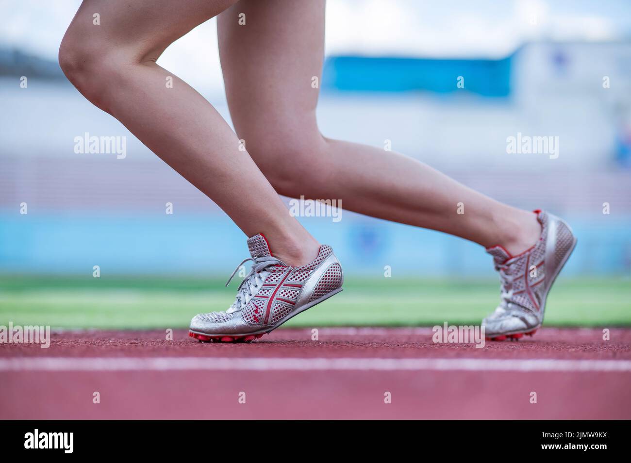 Close-up of female legs. The runner in the stadium Stock Photo - Alamy