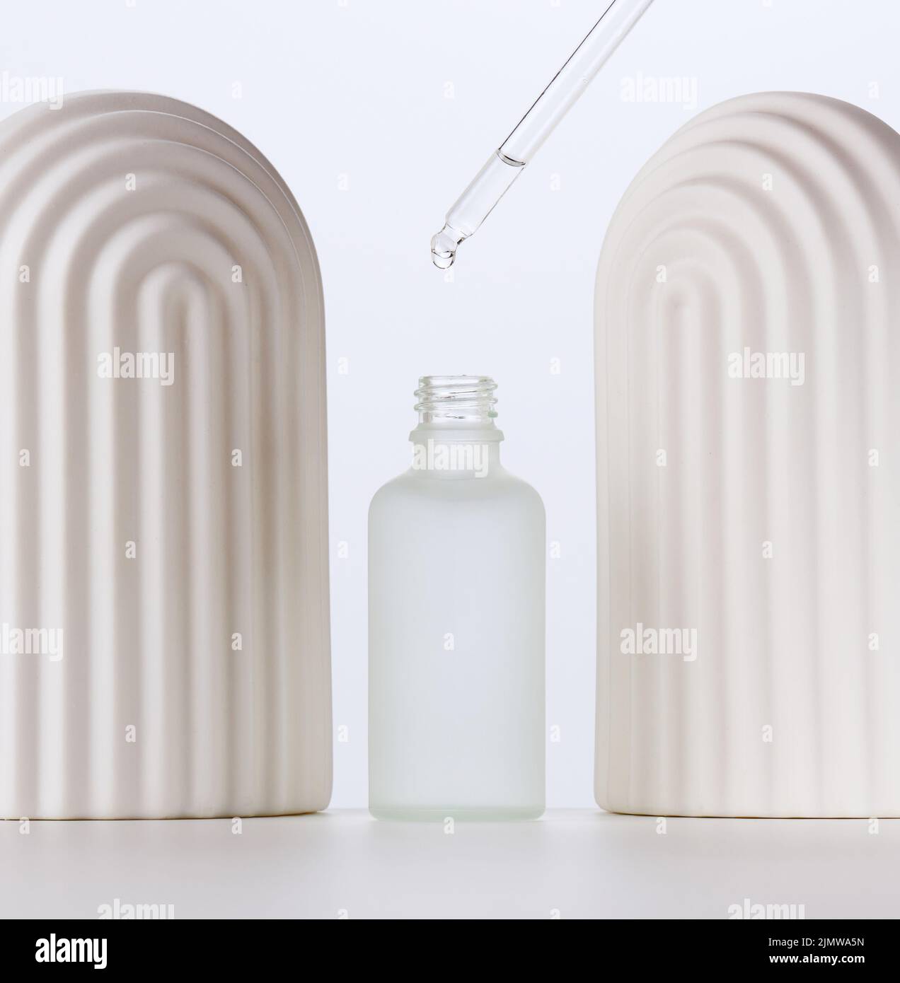 White glass bottle with pipette for cosmetics, oils and serum ...