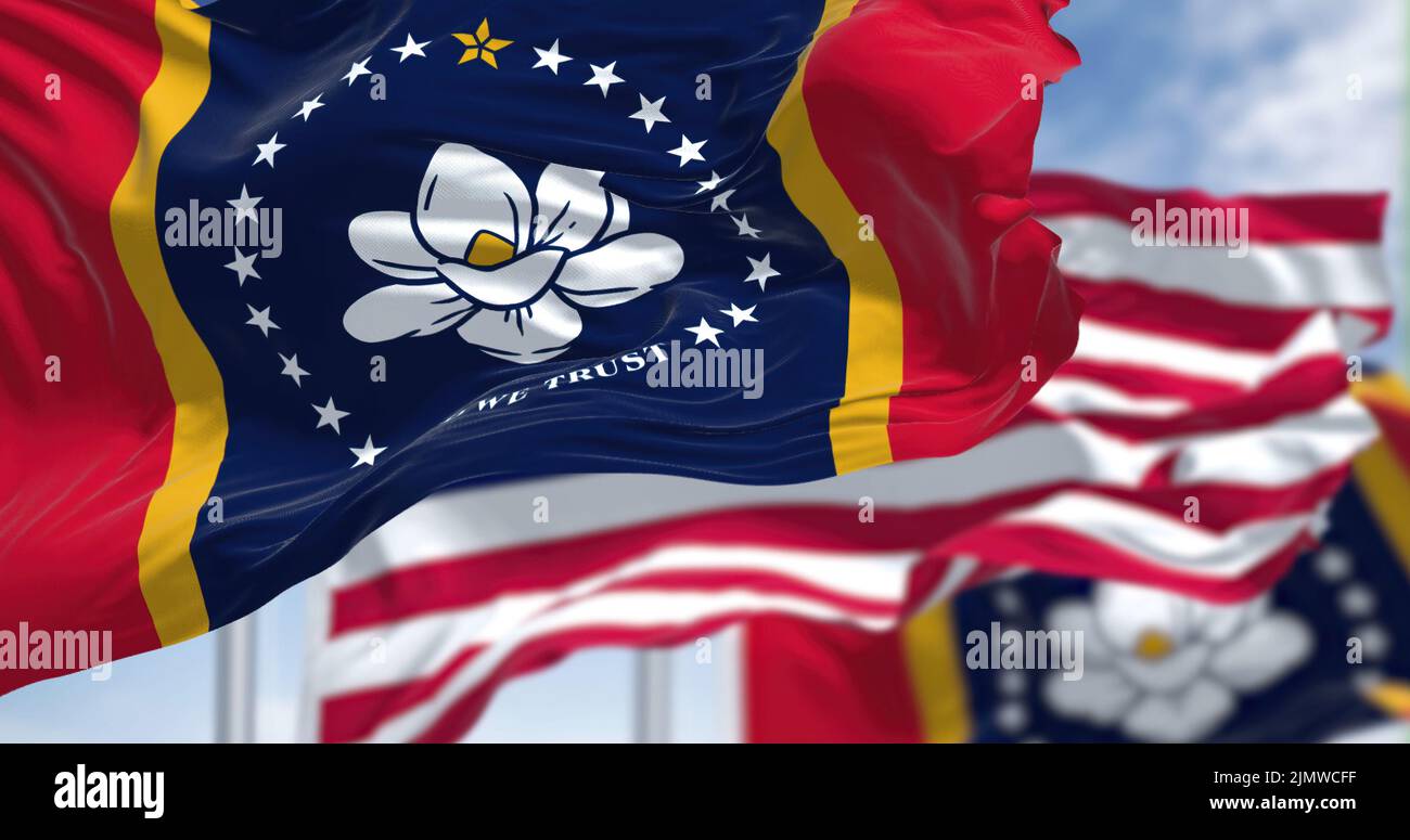 The Mississippi state flag waving along with the national flag of the ...