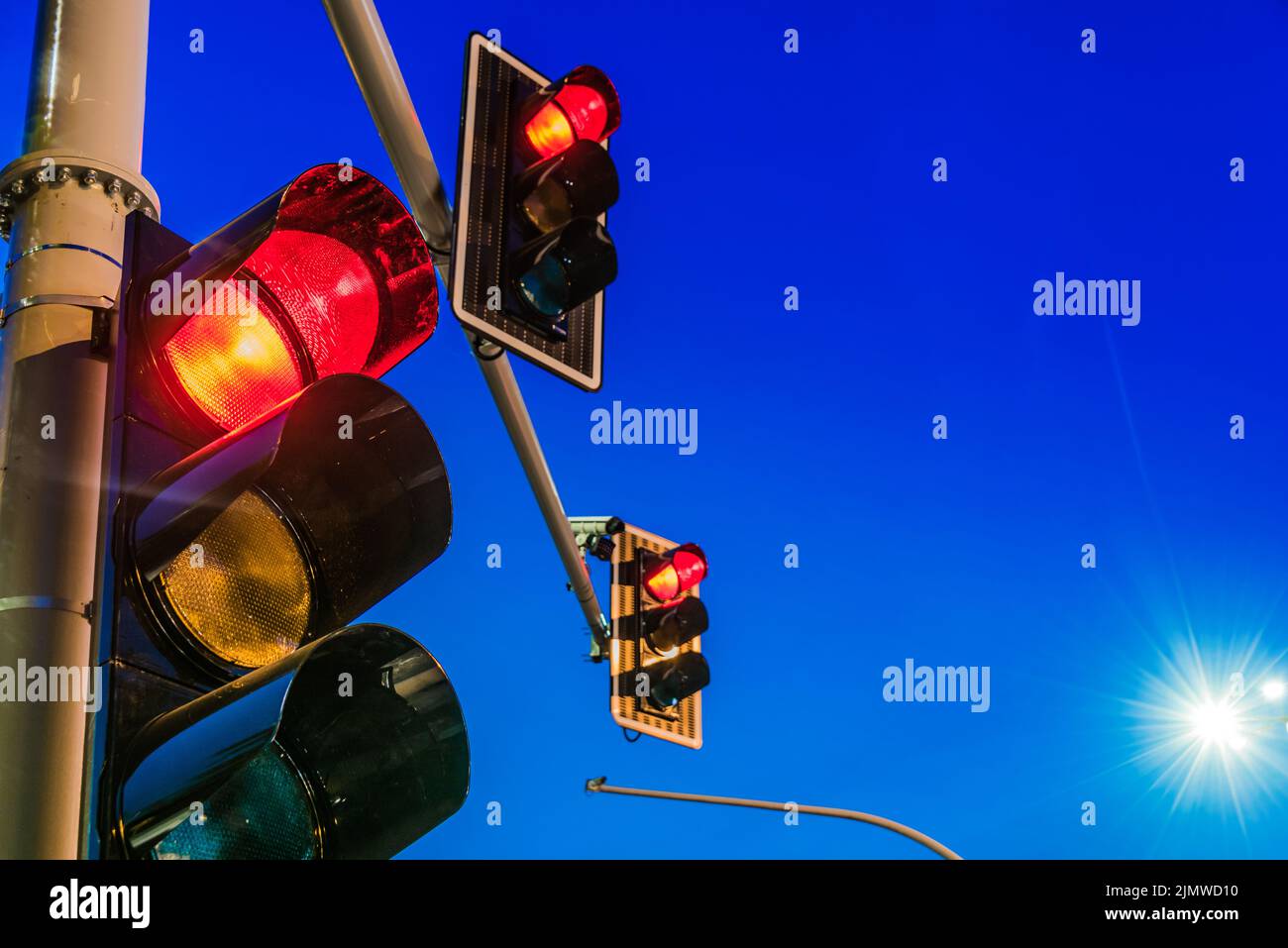 Traffic lights over urban intersection Stock Photo - Alamy