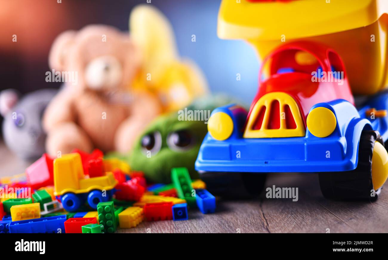 Colorful plastic and plush toys in a children's room Stock Photo - Alamy
