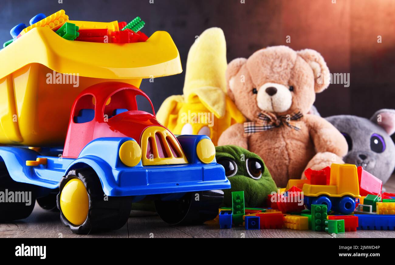 Colorful plastic and plush toys in a children's room Stock Photo - Alamy