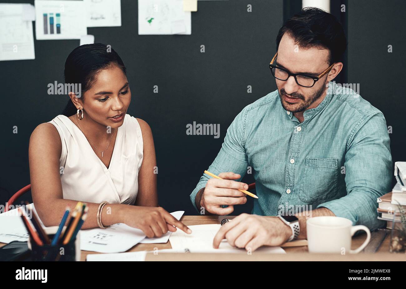 Creative minds doing what they do best. two young architects working ...