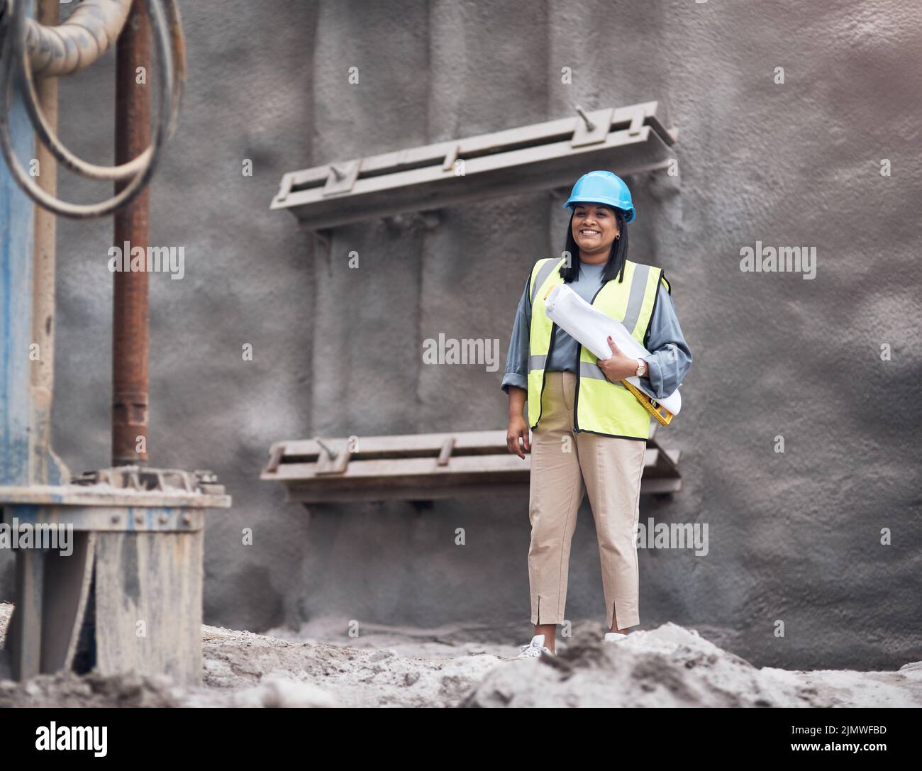 On site with a smile. Cropped portrait of an attractive young female ...