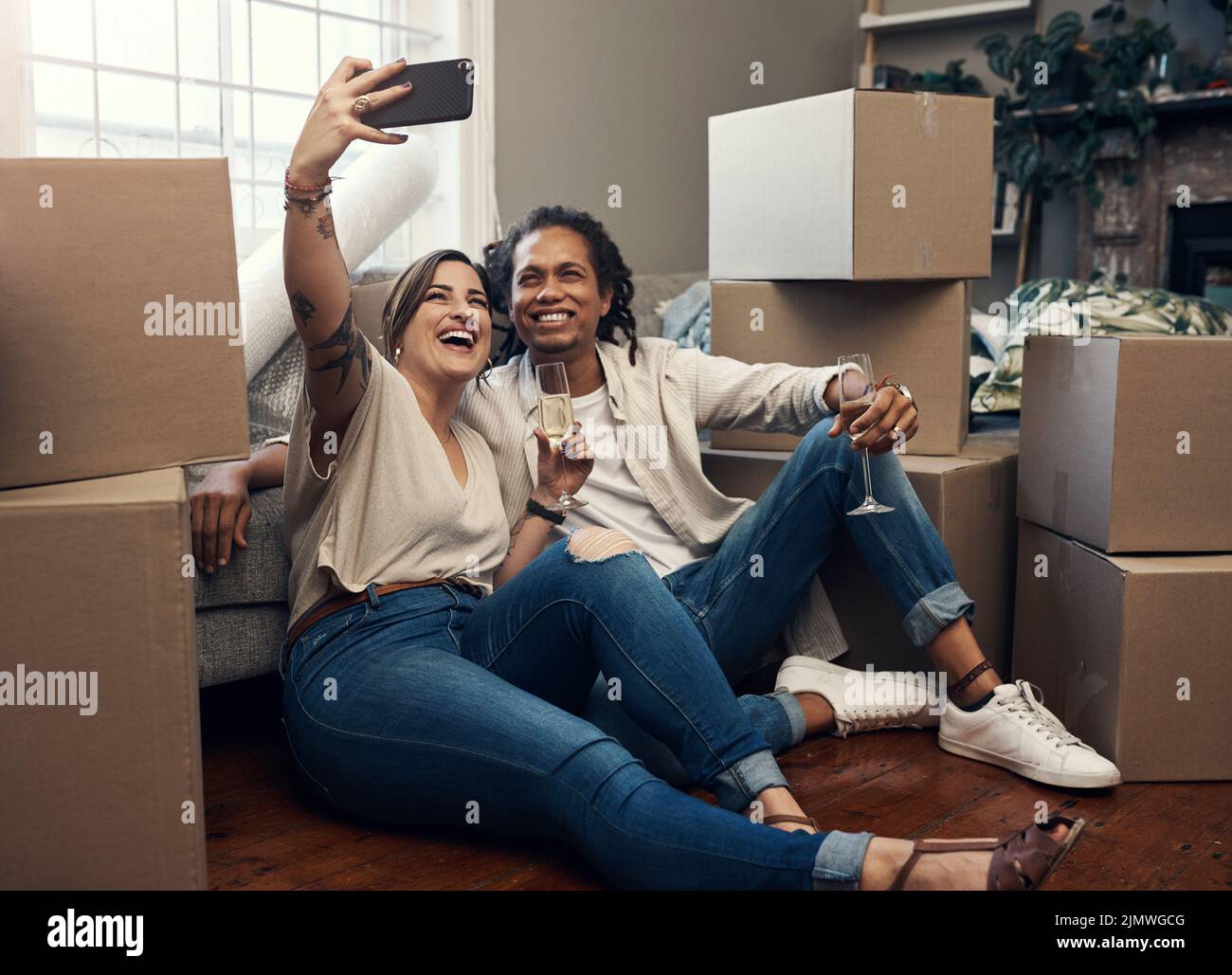 Two people busy moving house hi-res stock photography and images - Alamy