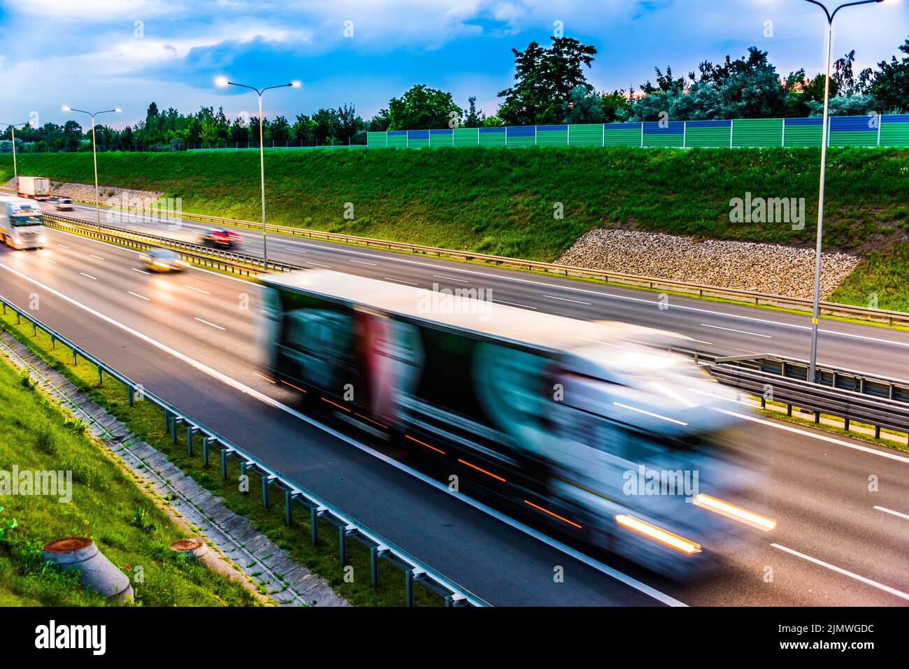 Trucks on six lane controlled-access highway in Poland Stock Photo - Alamy