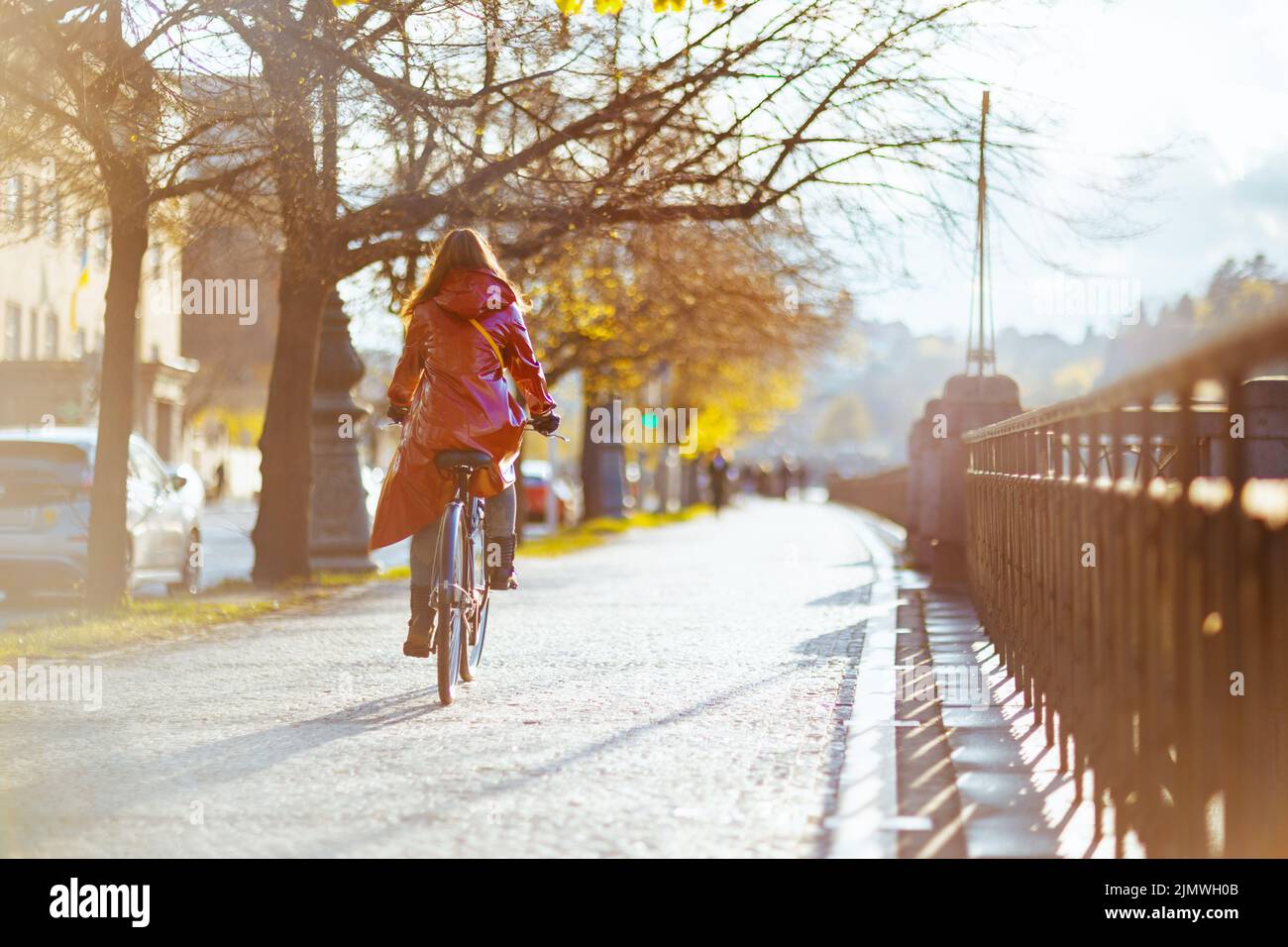 Woman seen riding bicycle hi-res stock photography and images - Alamy