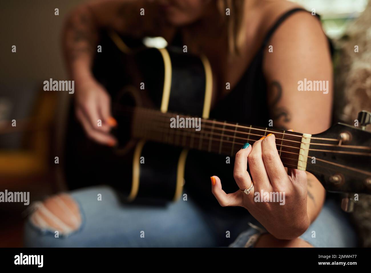 Music that plucks at the heartstrings. an unrecognizable woman playing ...