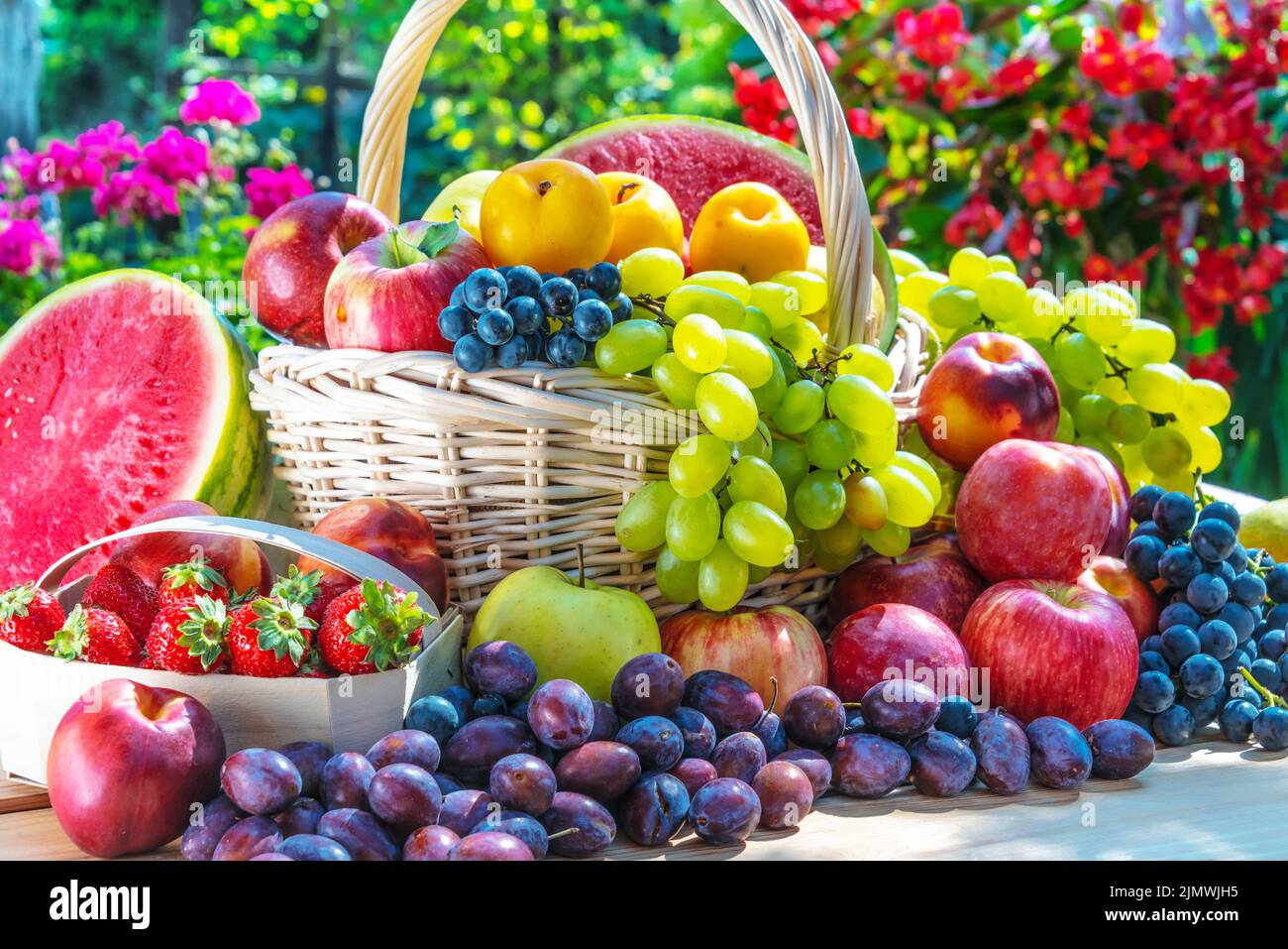 Variety of fresh ripe fruits in the garden. Balanced diet Stock Photo ...