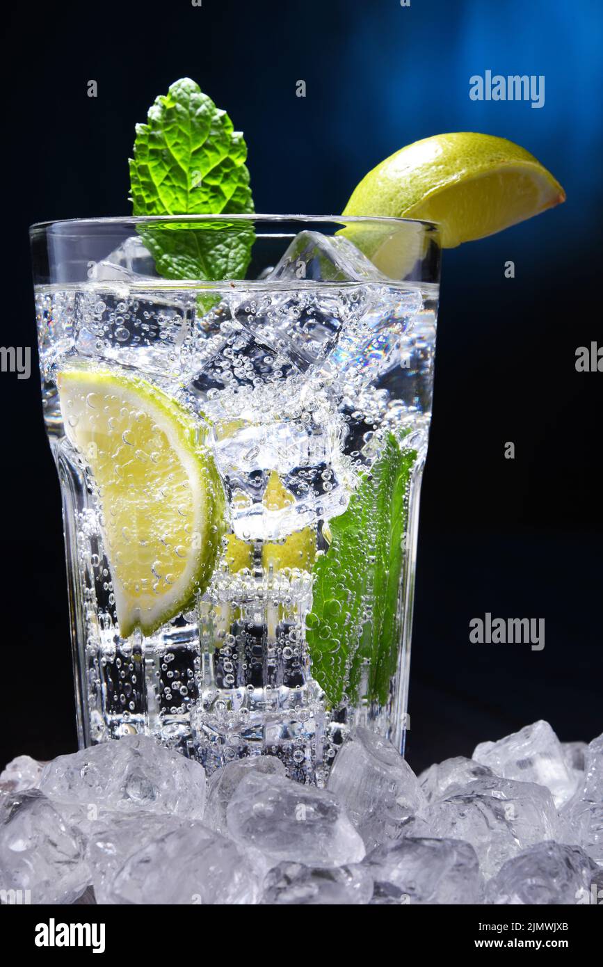 Glass of mineral water with ice Stock Photo - Alamy