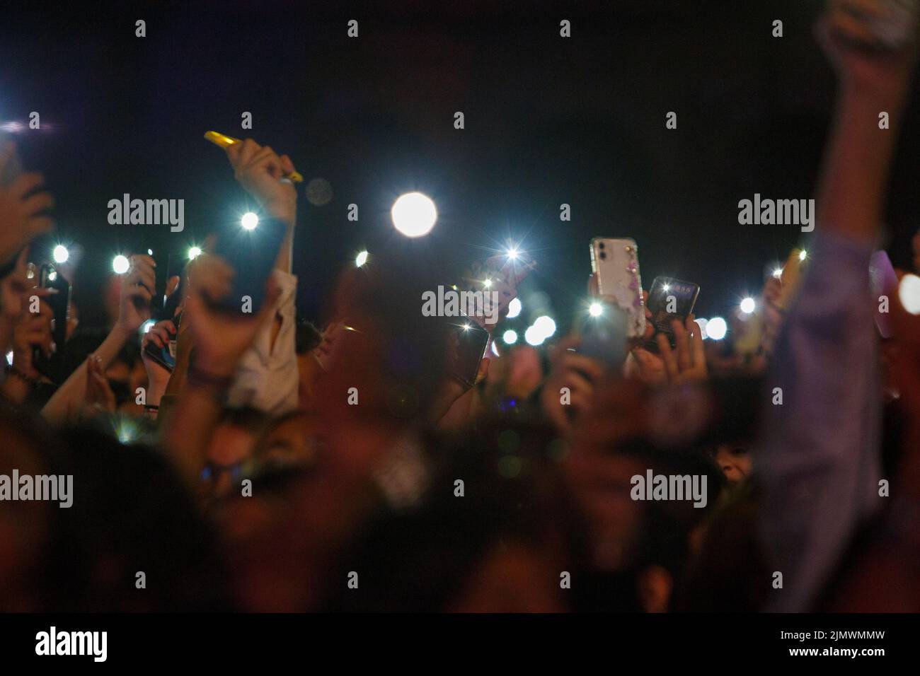 Performance on stage silhouette of people holding hi-res stock ...