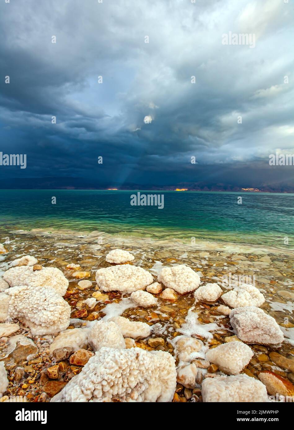 Rocky beach covered with salt Stock Photo - Alamy