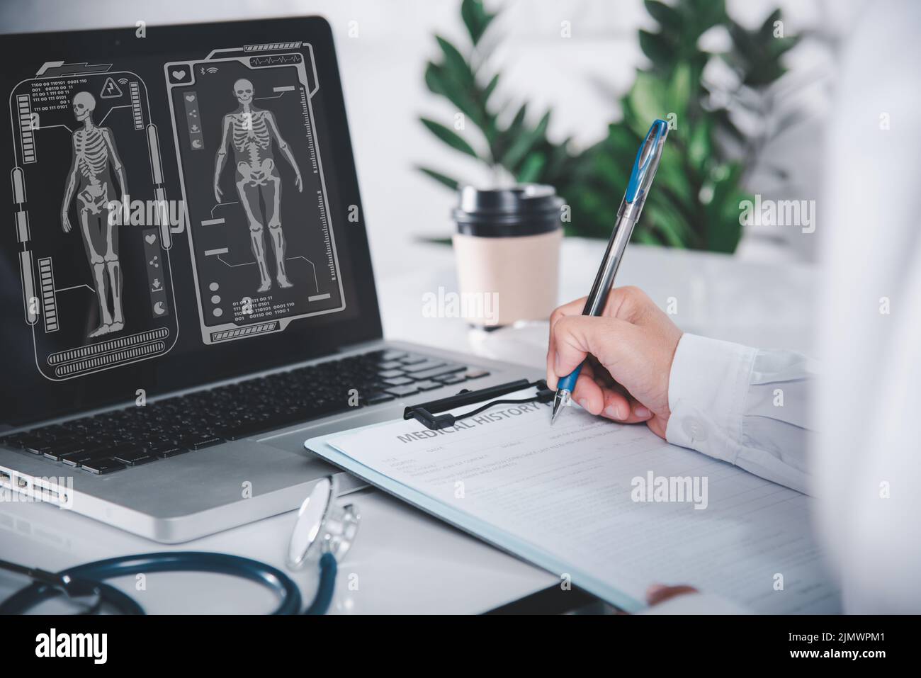 Closeup of doctor or nurse woman in uniform with stethoscope writing ...