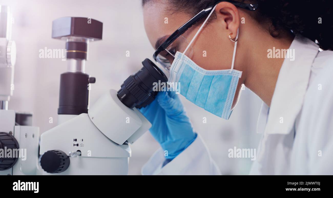 Science is filled with many mysteries. a young scientist using a ...