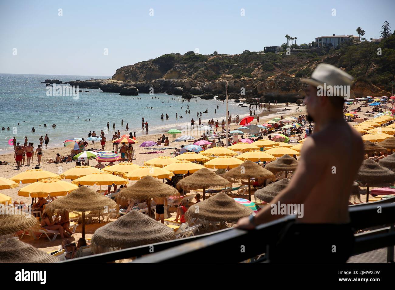 Lisbon, Algarve region. 6th Aug, 2022. Beachgoers sunbathe and swim at ...
