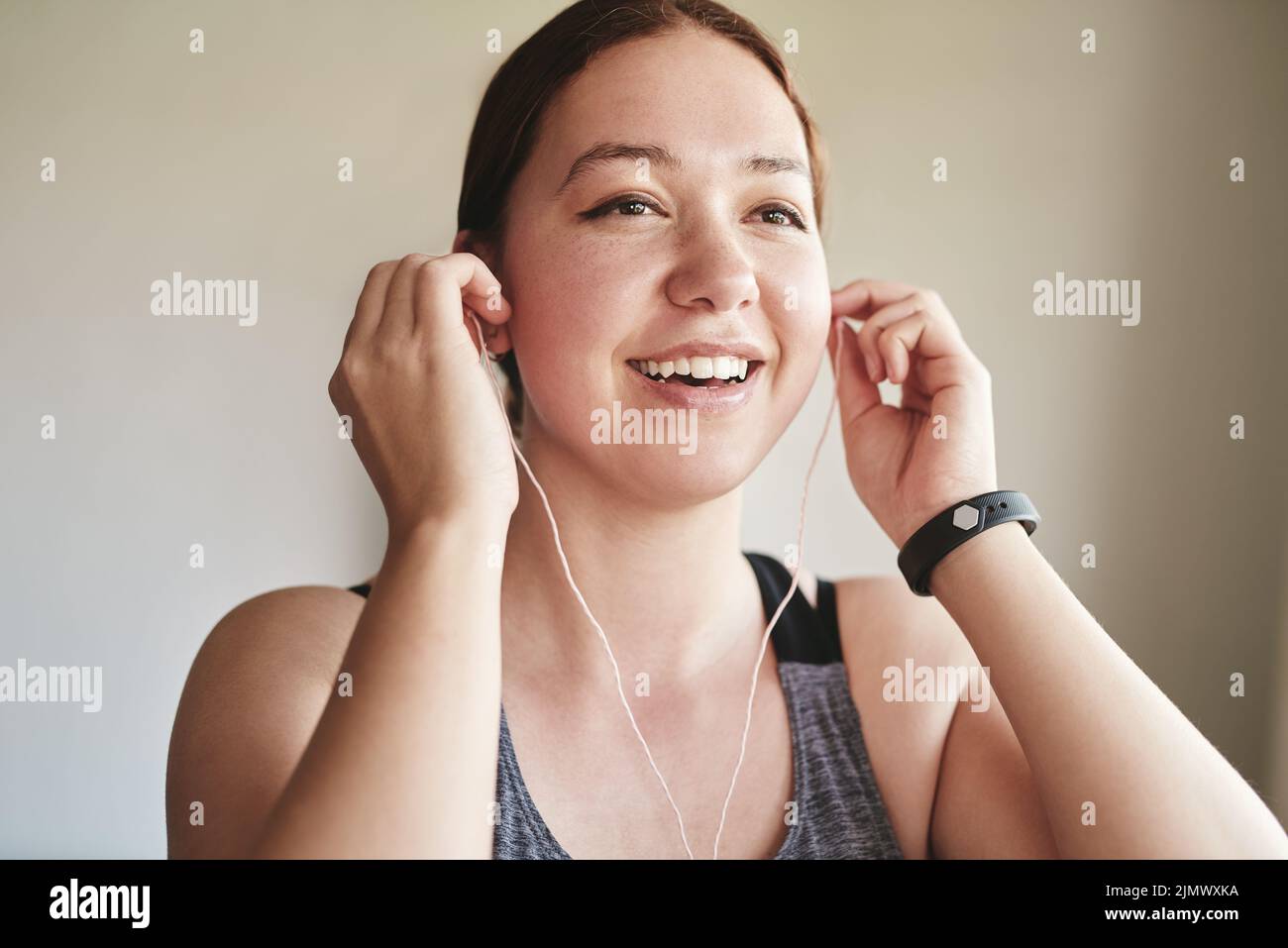 Music ready, lets go. an attractive young woman standing alone and ...