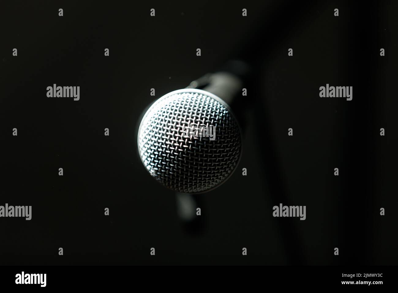 Microphone close up on a dark background Stock Photo - Alamy