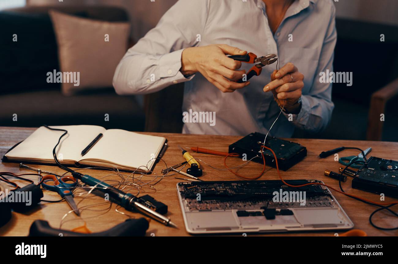 Making the necessary repairs. an unrecognizable female computer ...