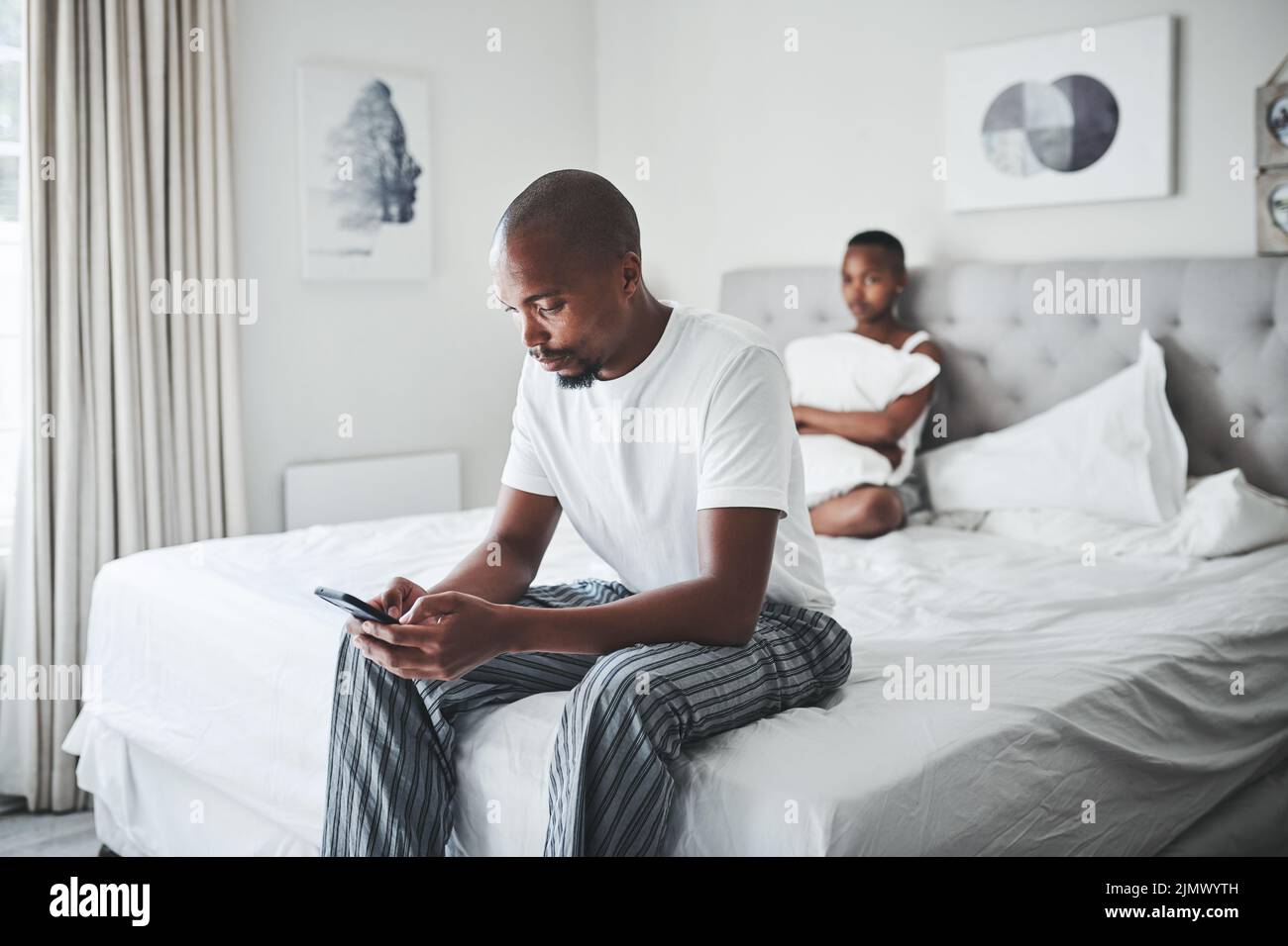 He used to hold me like that. a young man ignoring his wife while using ...