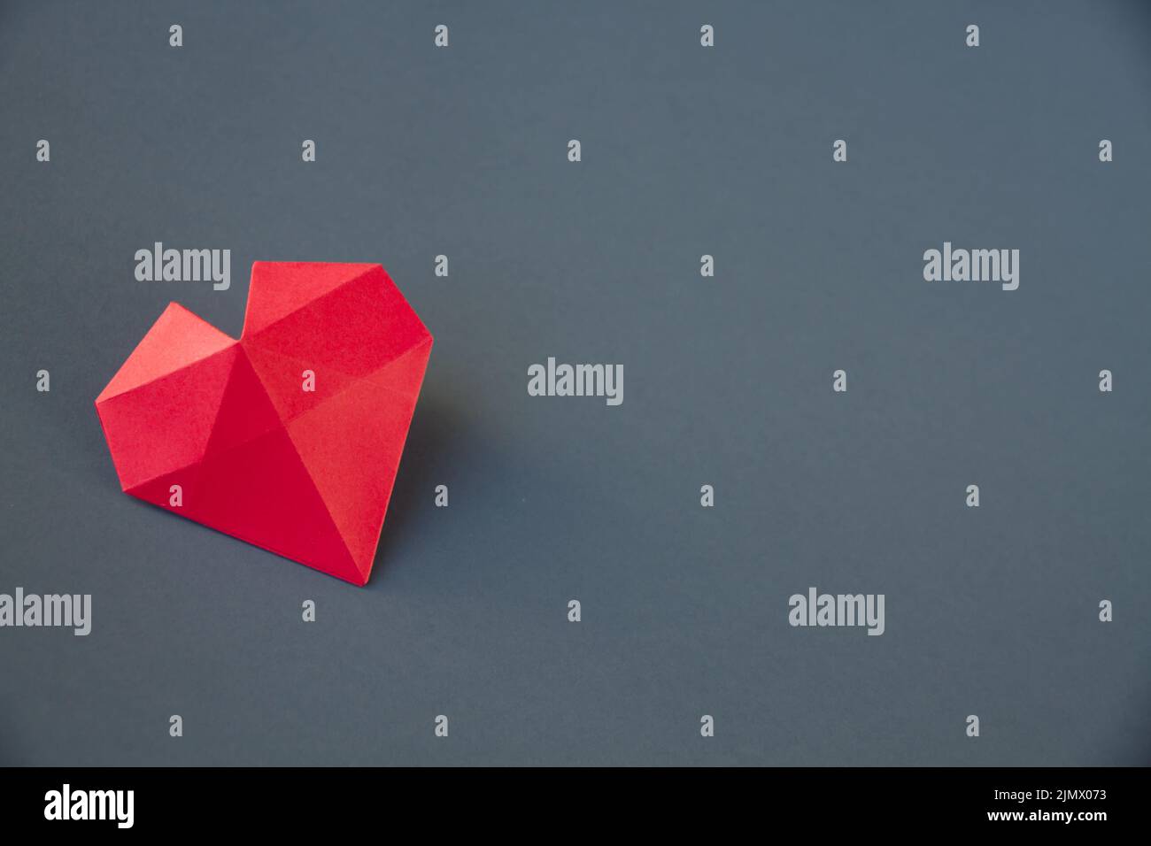 Red paper heart origami isolated on a grey background Stock Photo - Alamy