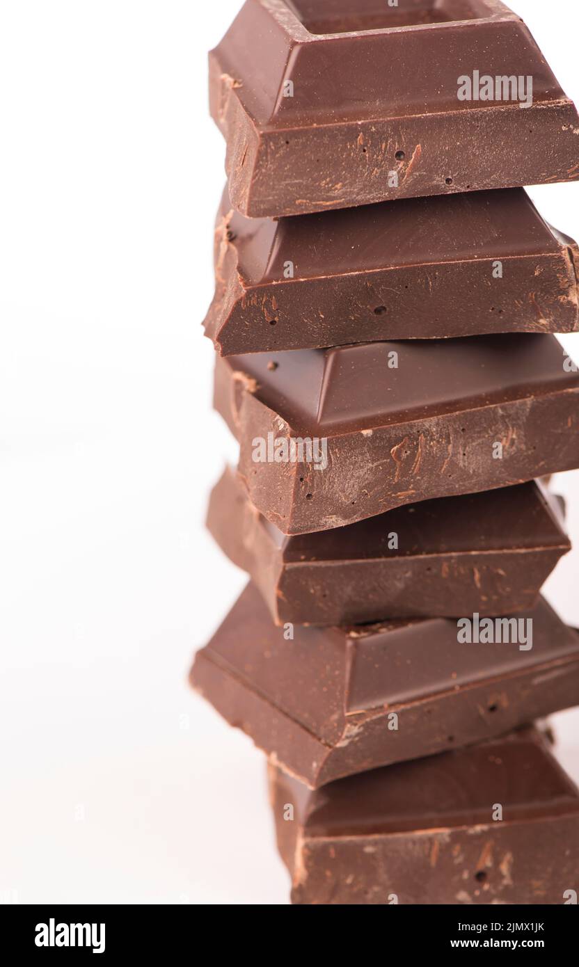 chocolate pieces isolated on white Stock Photo - Alamy
