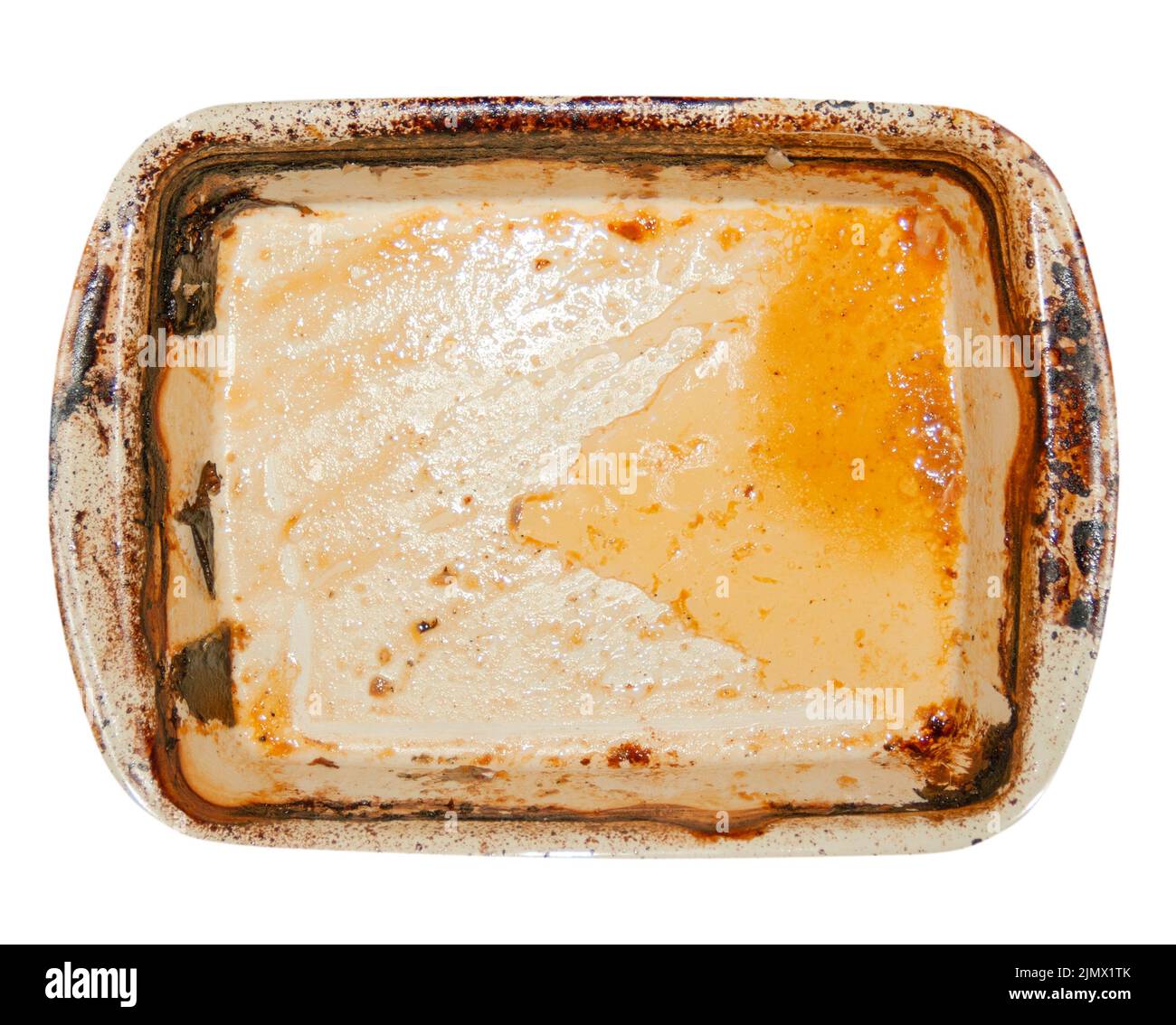 Baking tray with burnt on grease and oil isolated on white background ...