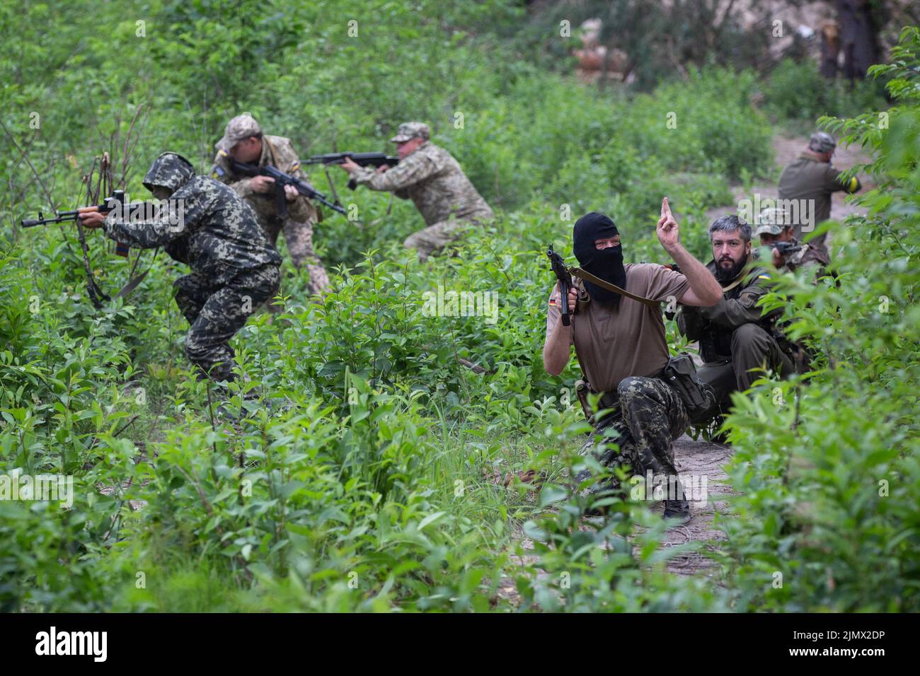 Members of the Bucha territorial defense forces hold their positions as ...