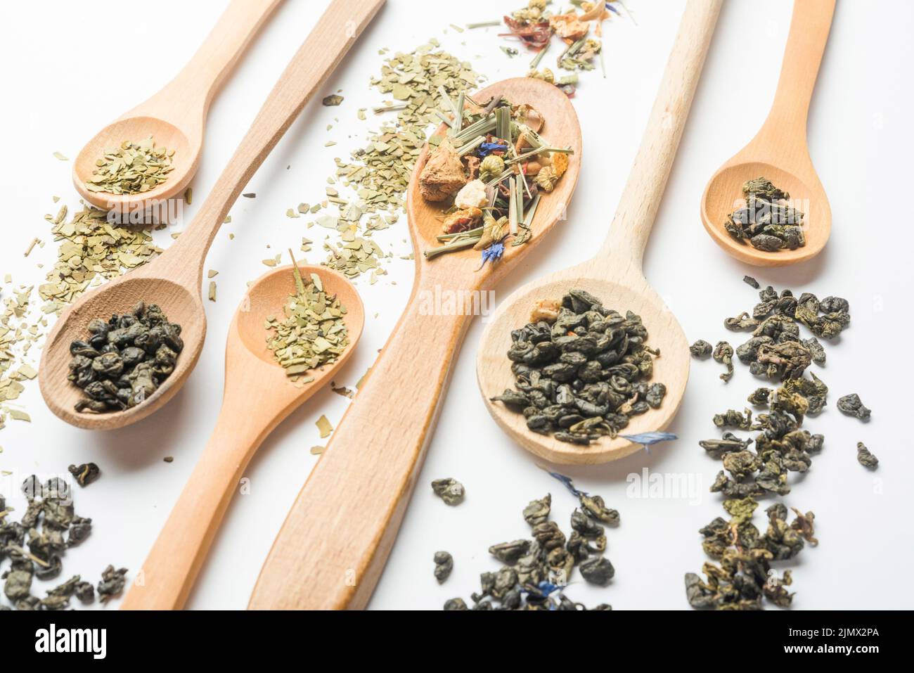 Various kinds herbal tea wooden spoons white background Stock Photo - Alamy