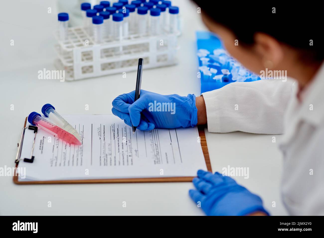 Noting down her findings with accuracy. Closeup shot of an ...
