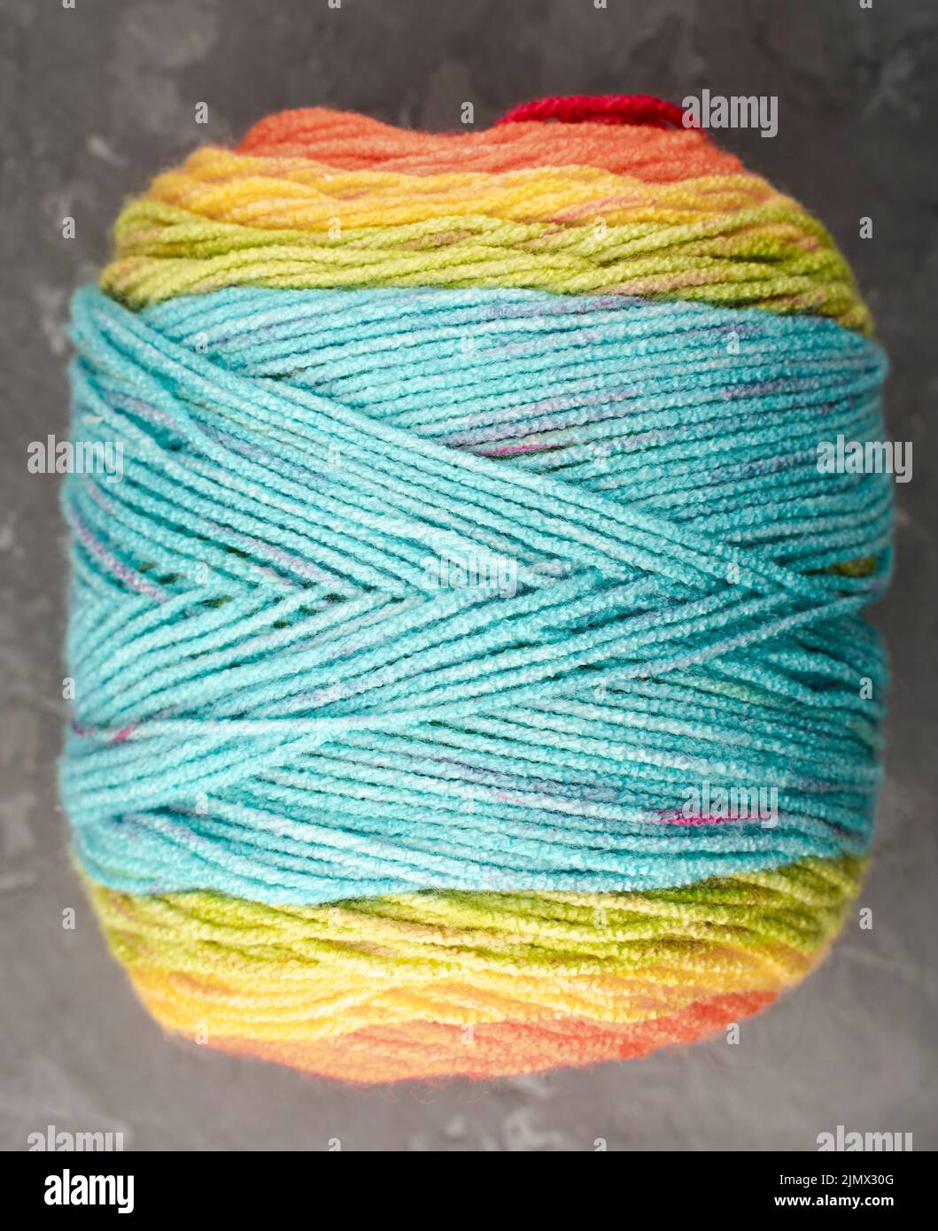 Turquoise yellow orange colored wool Stock Photo - Alamy