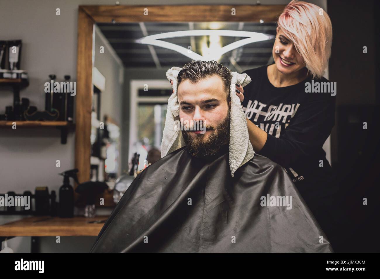 Woman wiping head customer salon Stock Photo - Alamy